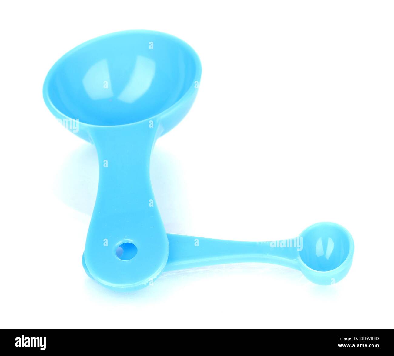 Blue measuring spoons isolated on white Stock Photo - Alamy