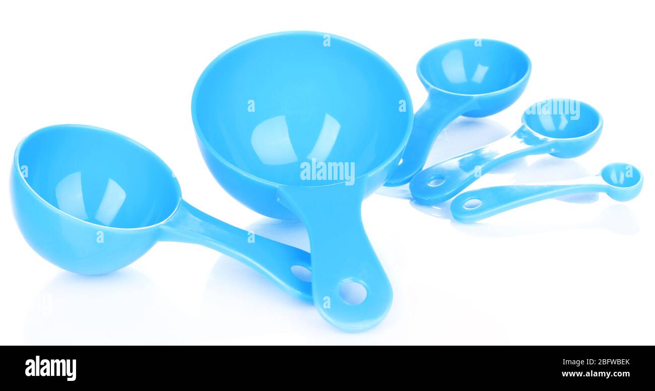 Blue measuring spoons isolated on white Stock Photo - Alamy