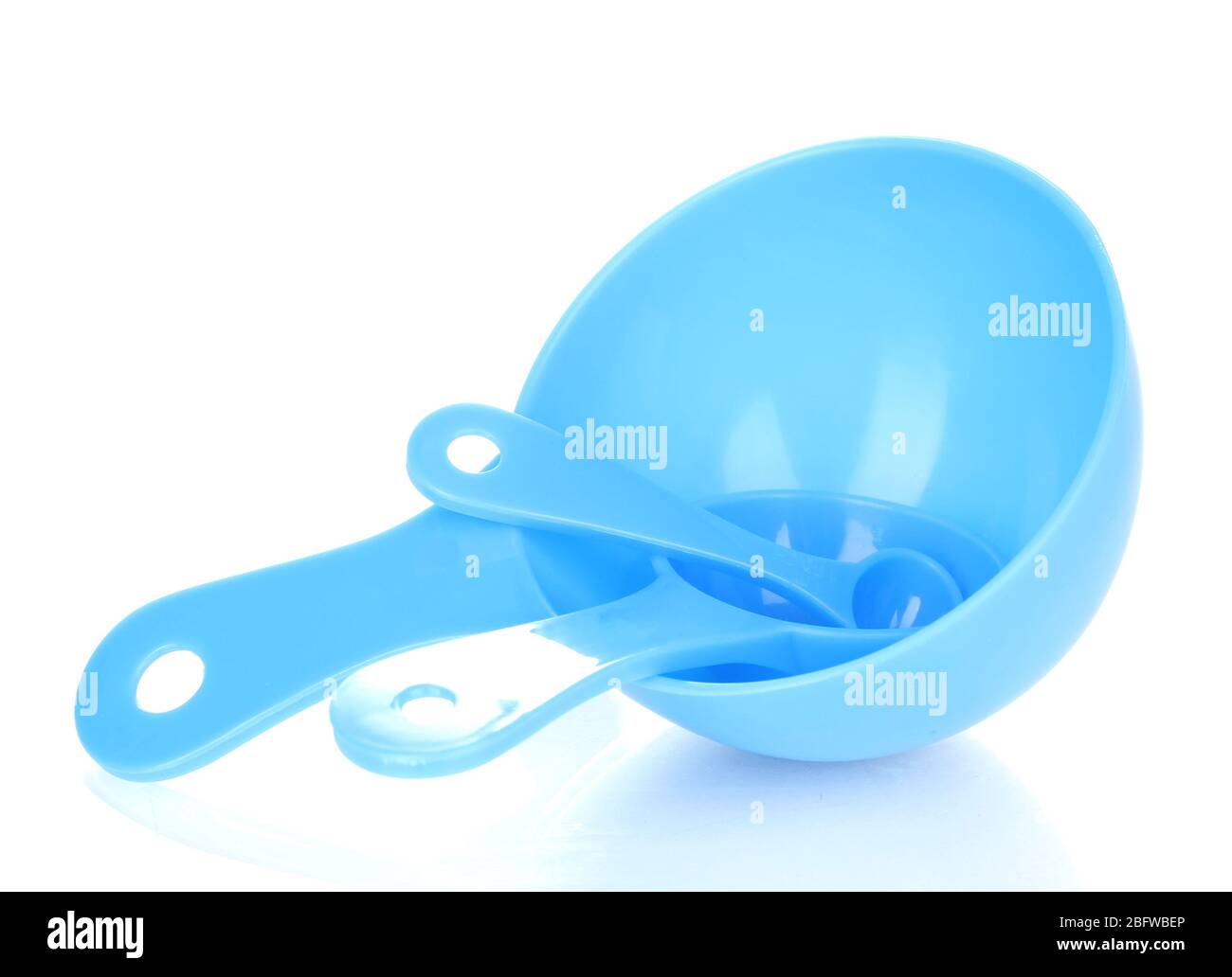 Blue measuring spoons isolated on white Stock Photo - Alamy