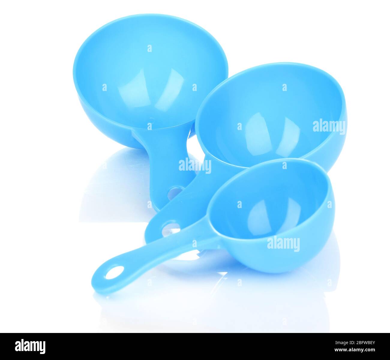 Blue measuring spoons isolated on white Stock Photo - Alamy