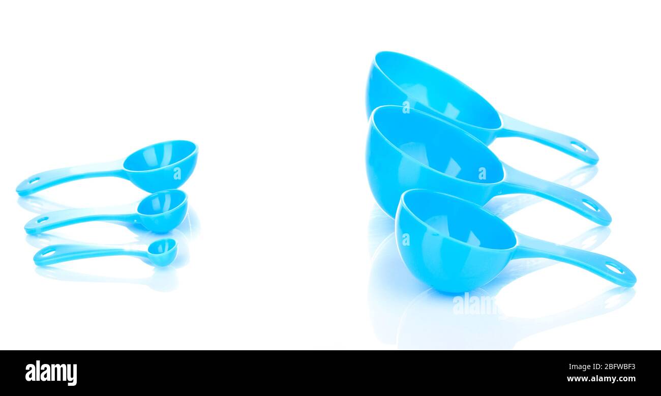 Blue measuring spoons isolated on white Stock Photo - Alamy