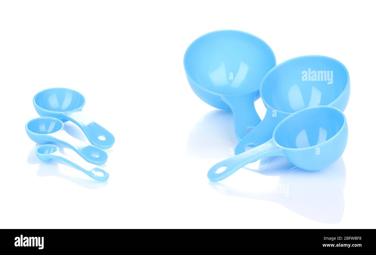 Blue measuring spoons isolated on white Stock Photo - Alamy