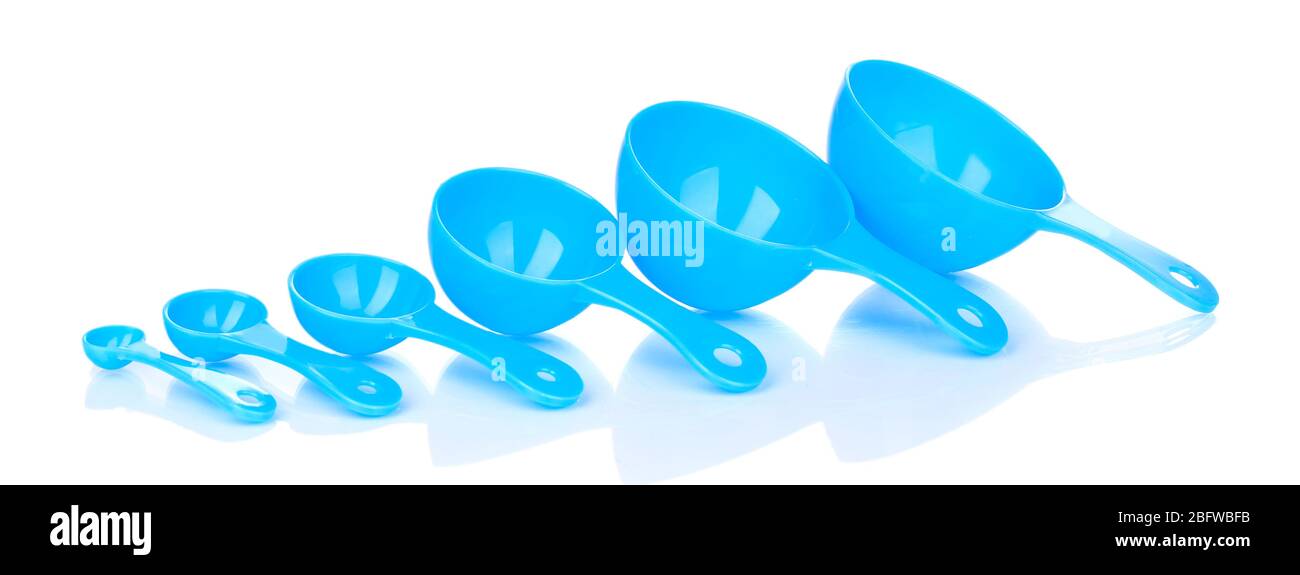 Blue measuring spoons isolated on white Stock Photo - Alamy