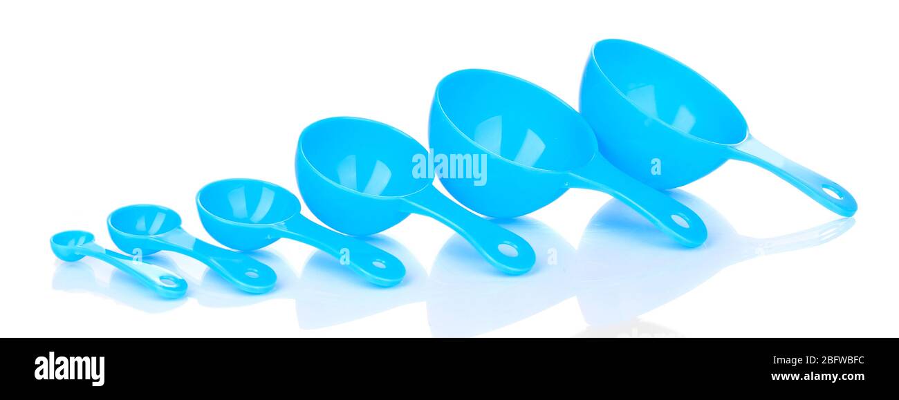 Blue measuring spoons isolated on white Stock Photo - Alamy