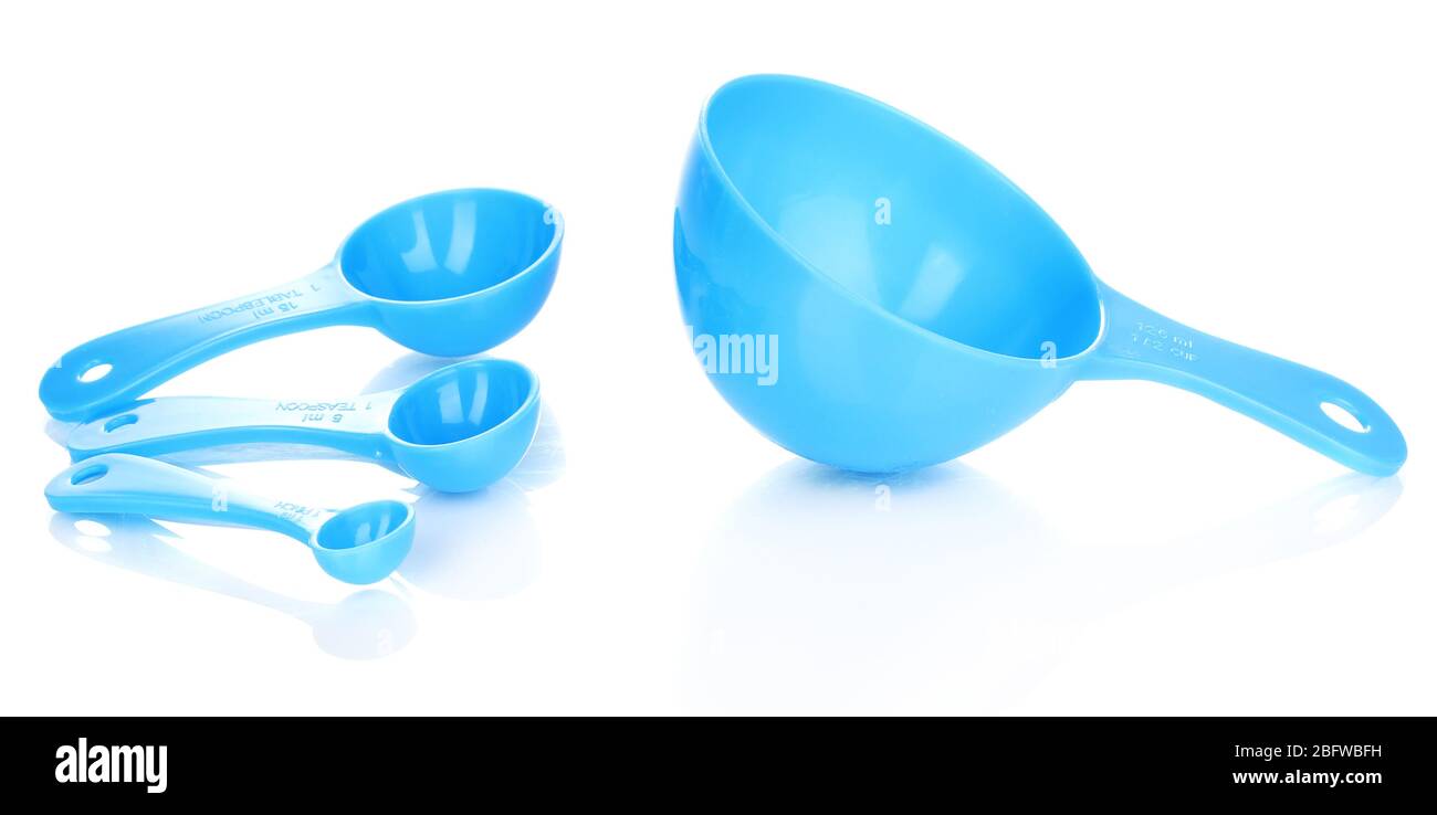 Blue measuring spoons isolated on white Stock Photo - Alamy