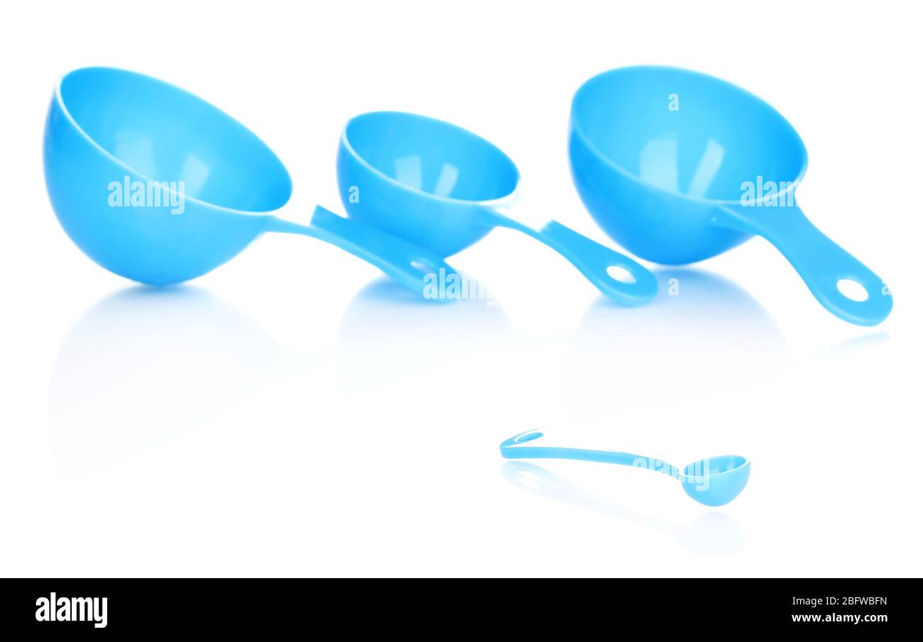 Blue measuring spoons isolated on white Stock Photo - Alamy