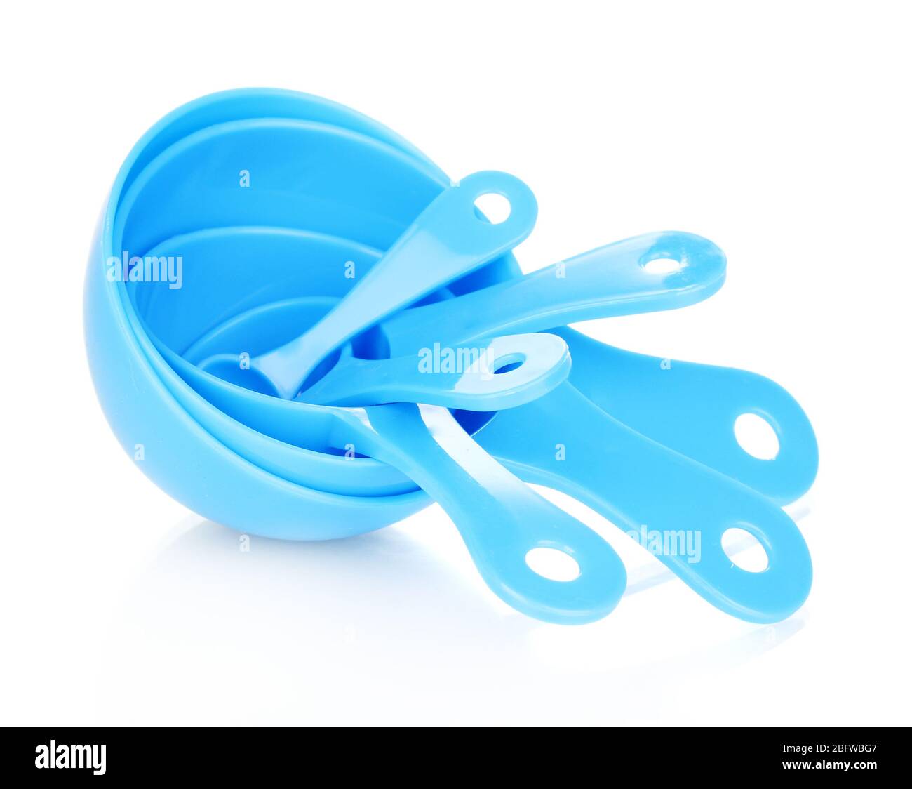 Blue measuring spoons isolated on white Stock Photo - Alamy