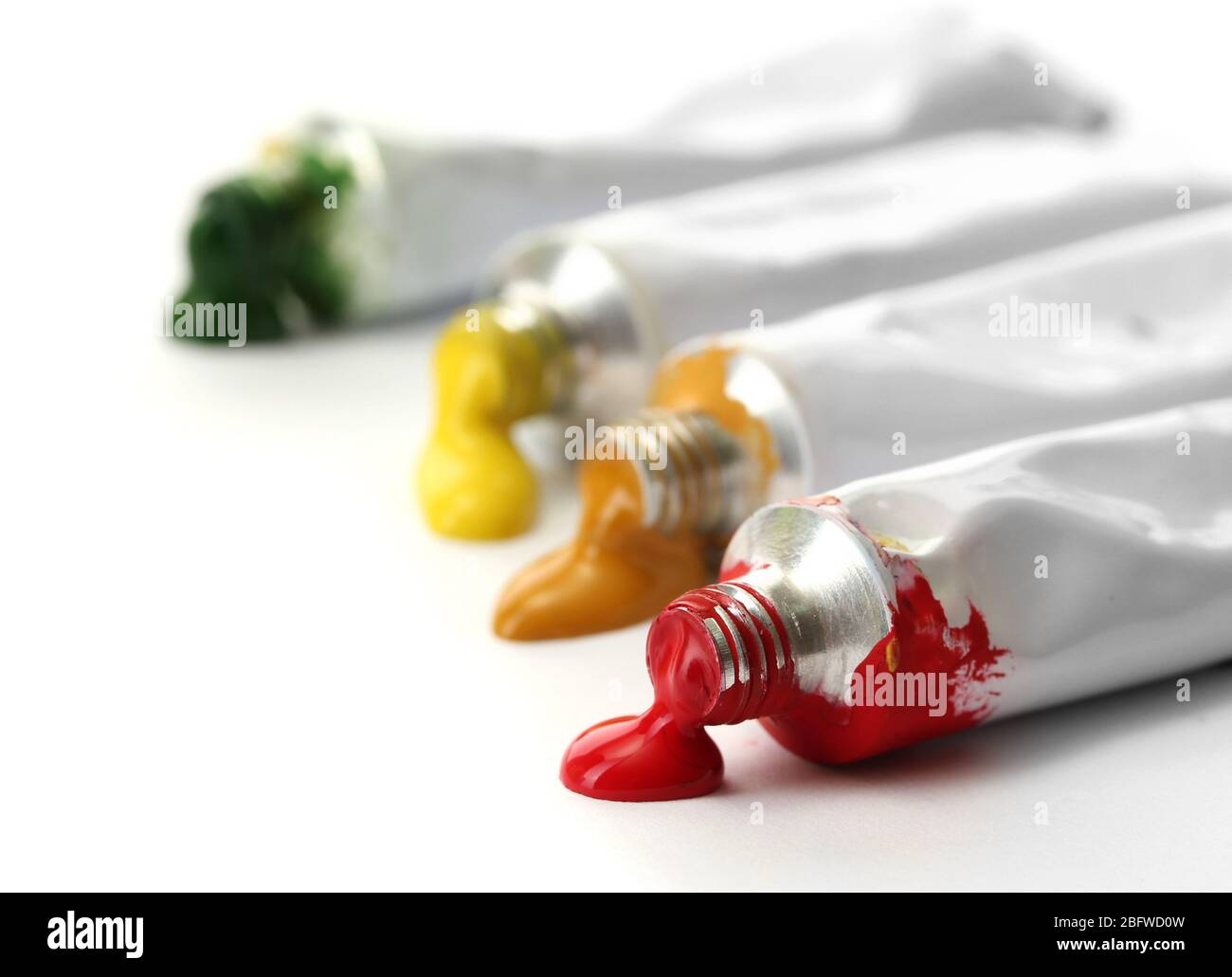 Abstract acrylic paint in tubes isolated on white Stock Photo - Alamy