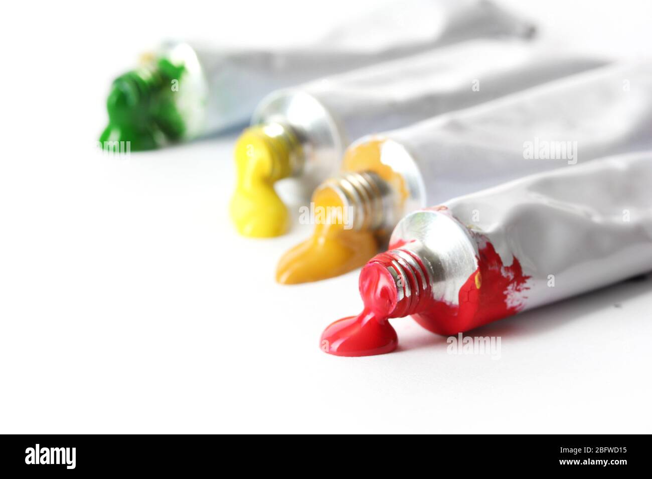 Abstract acrylic paint in tubes isolated on white Stock Photo - Alamy