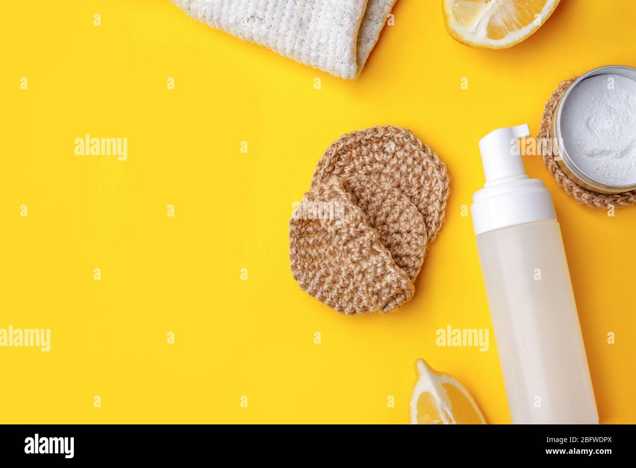 Set of eco-friendly natural cleaning products on yellow kitchen table ...