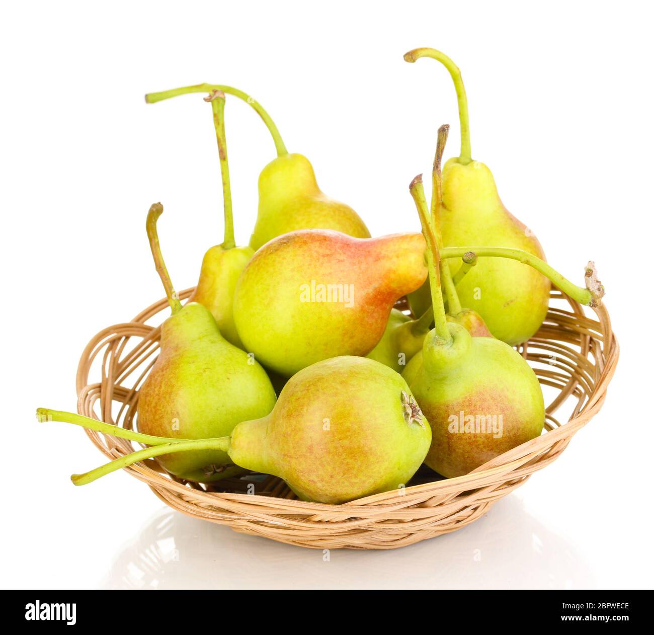 ripe pears in basket isolated on white Stock Photo - Alamy