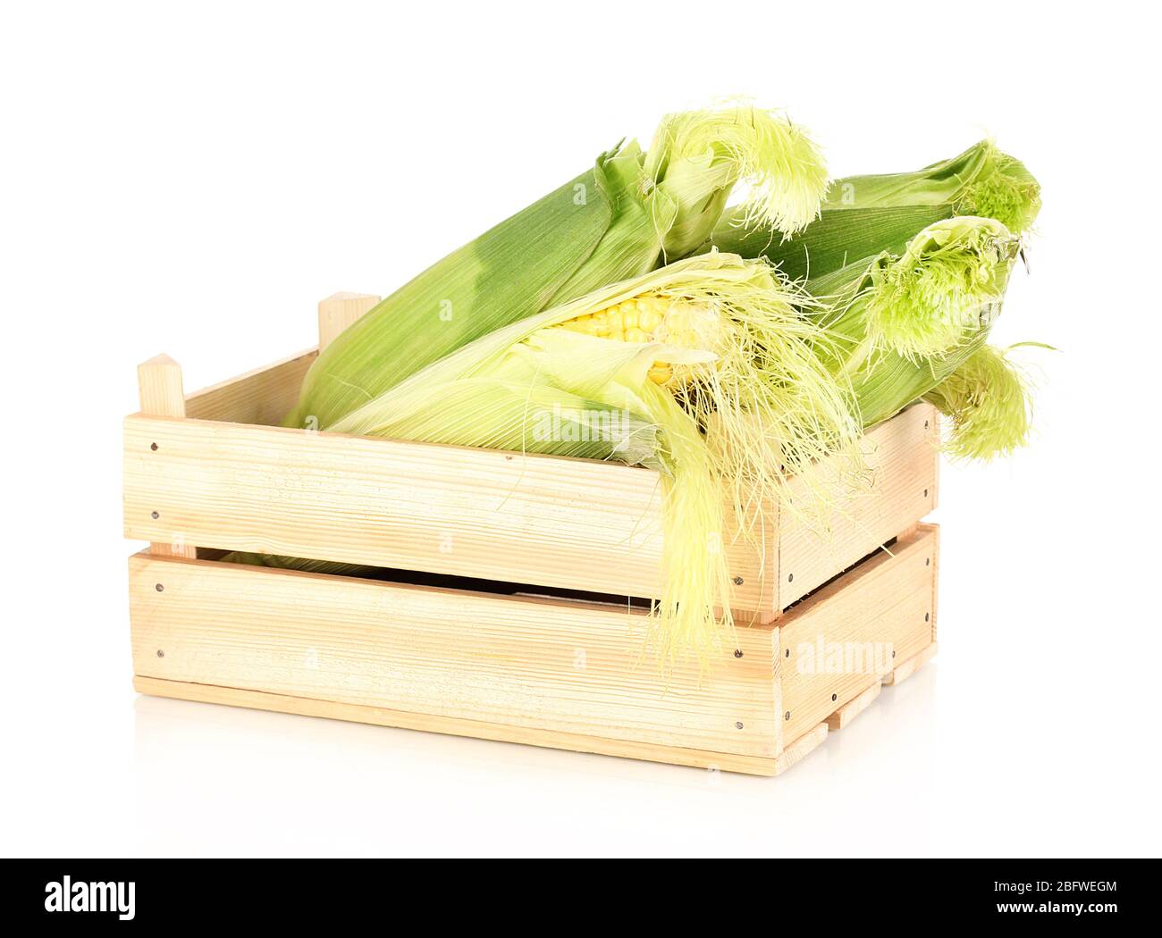 Fresh corn cobs in crate isolated on white Stock Photo - Alamy