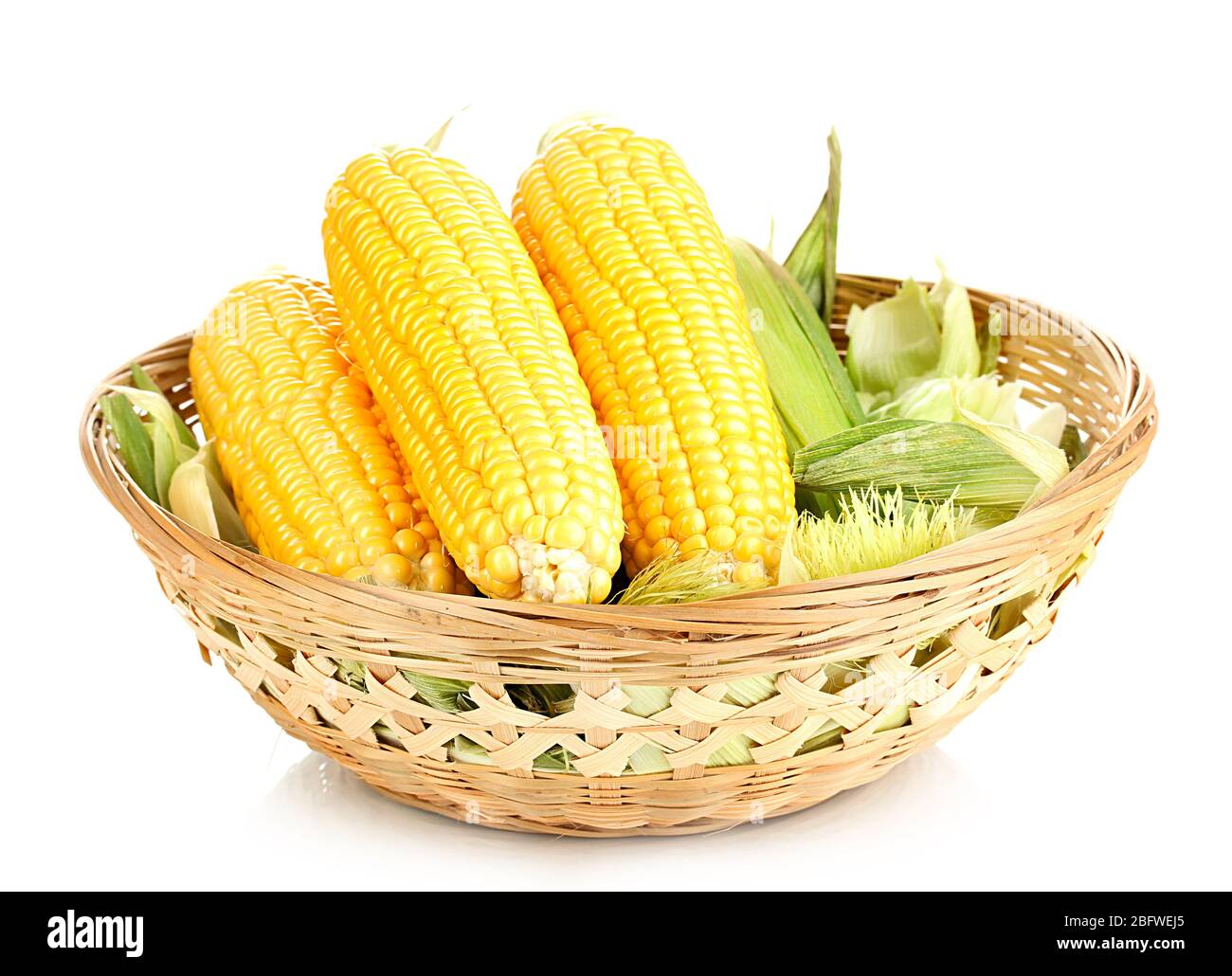 Fresh corn cobs in basket isolated on white Stock Photo - Alamy