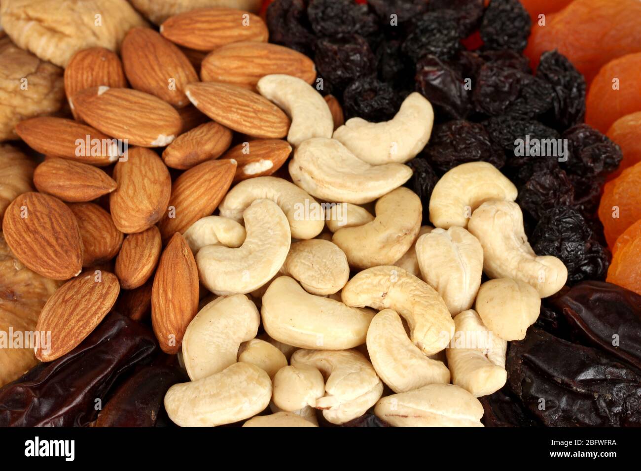 different dried fruits texture background Stock Photo - Alamy