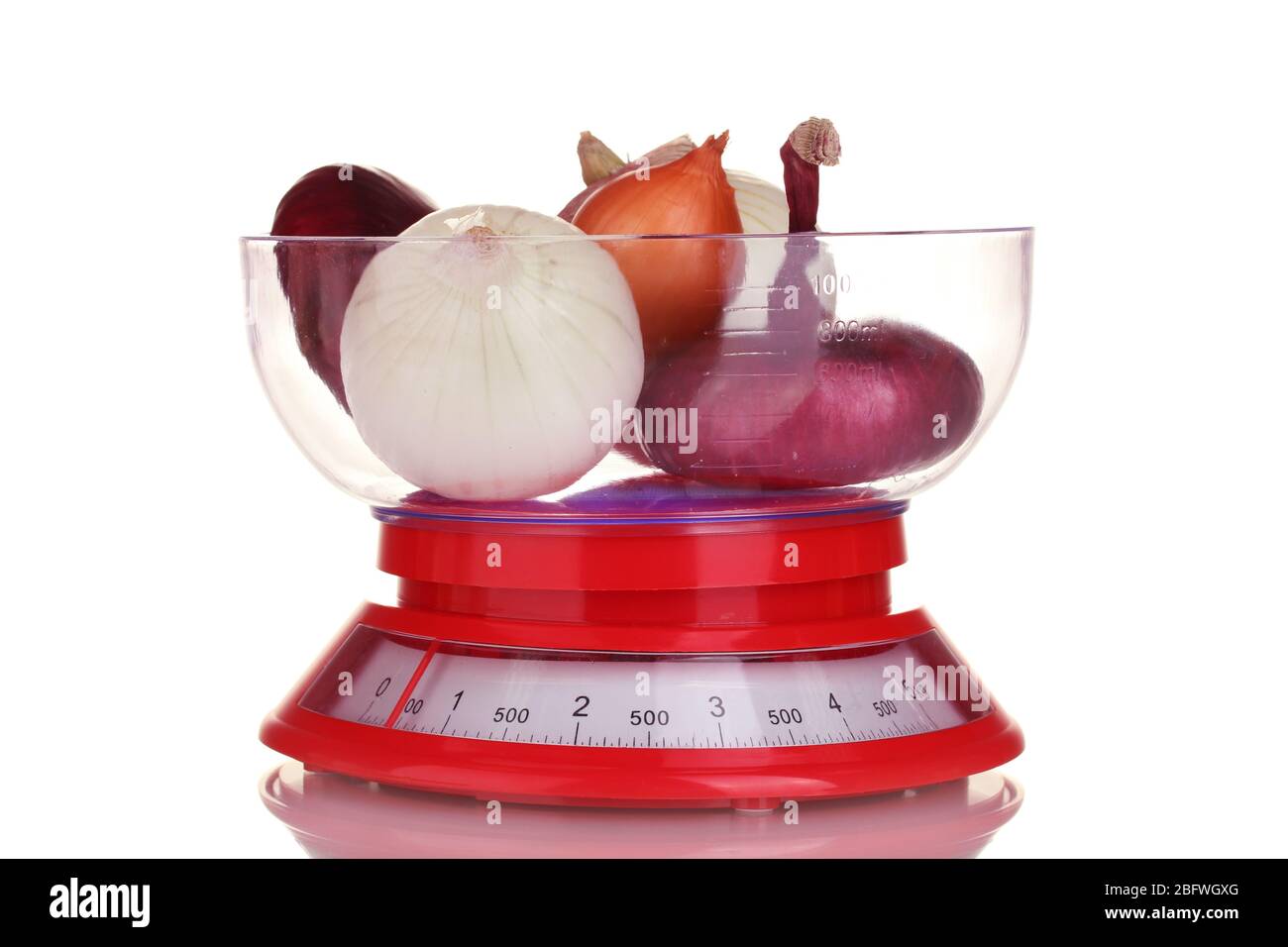 different types of onions in a kitchen scales isolated on white Stock ...