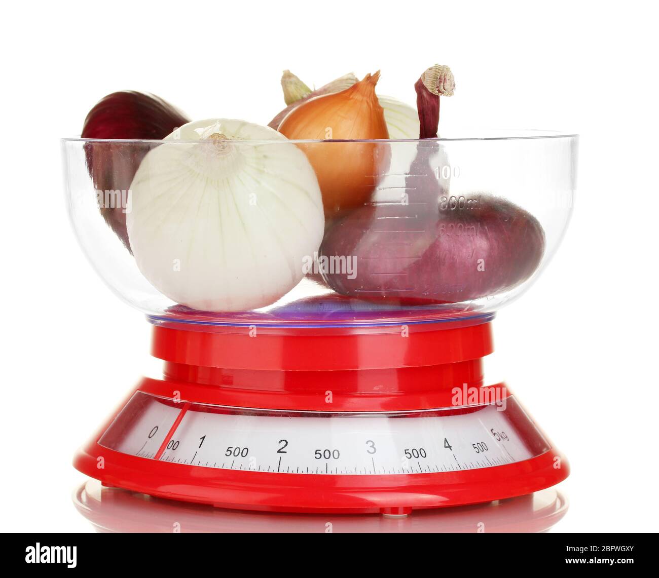 different types of onions in a kitchen scales isolated on white Stock ...
