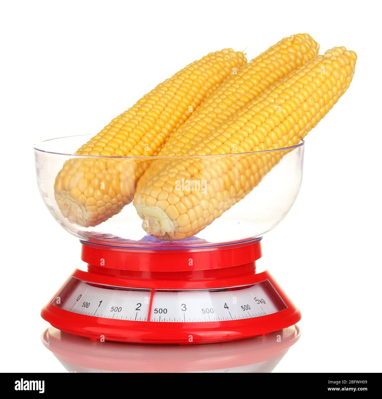 fresh corn in a kitchen scales isolated on white Stock Photo - Alamy