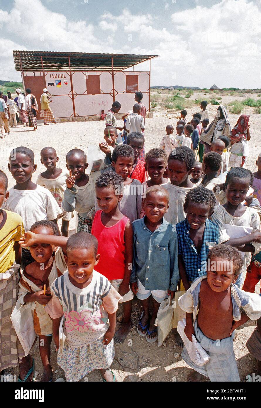1993 - Children gather outside of a school house in Belet Uen, Somalia ...