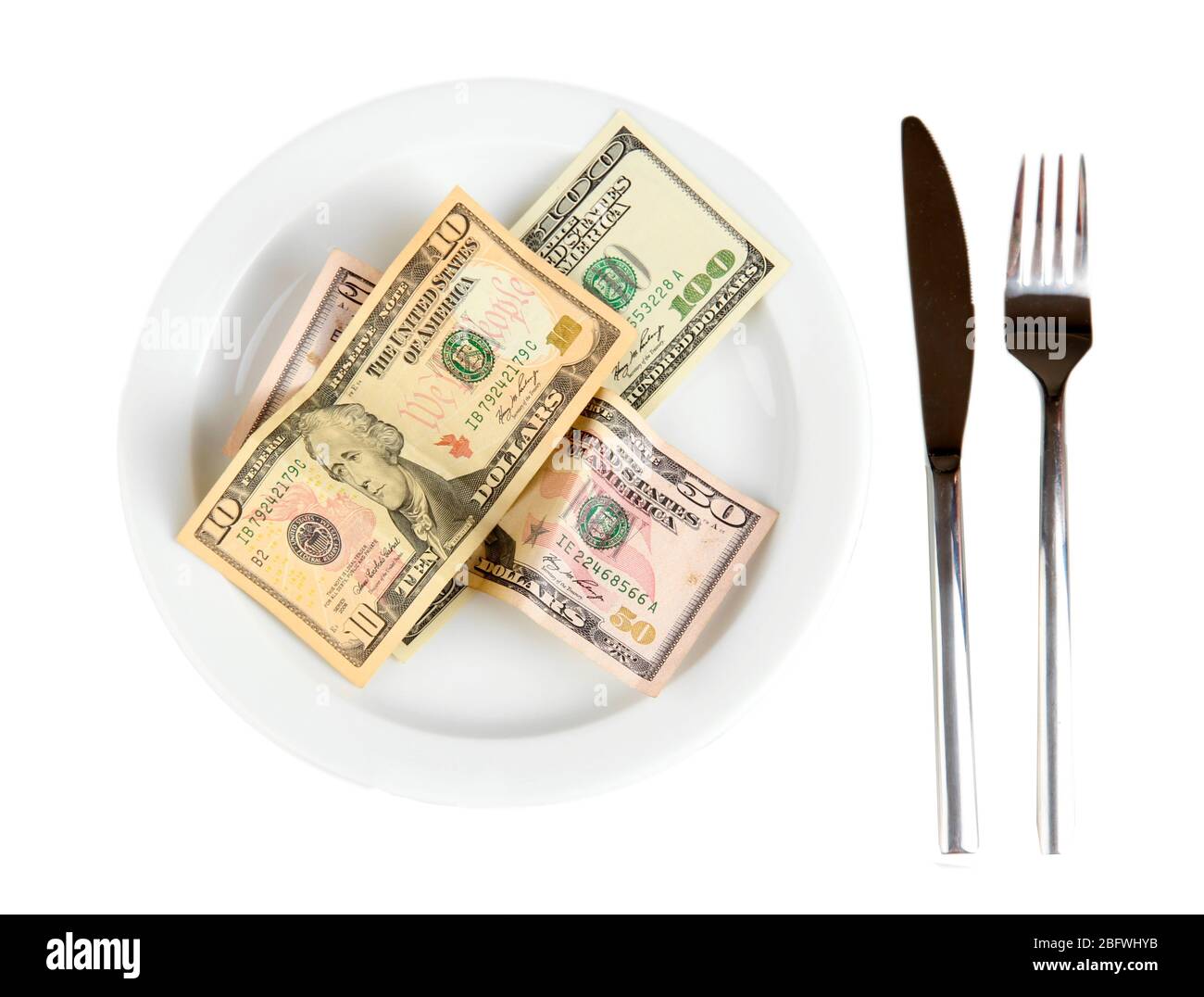 Money on plate isolated on white background close-up Stock Photo - Alamy