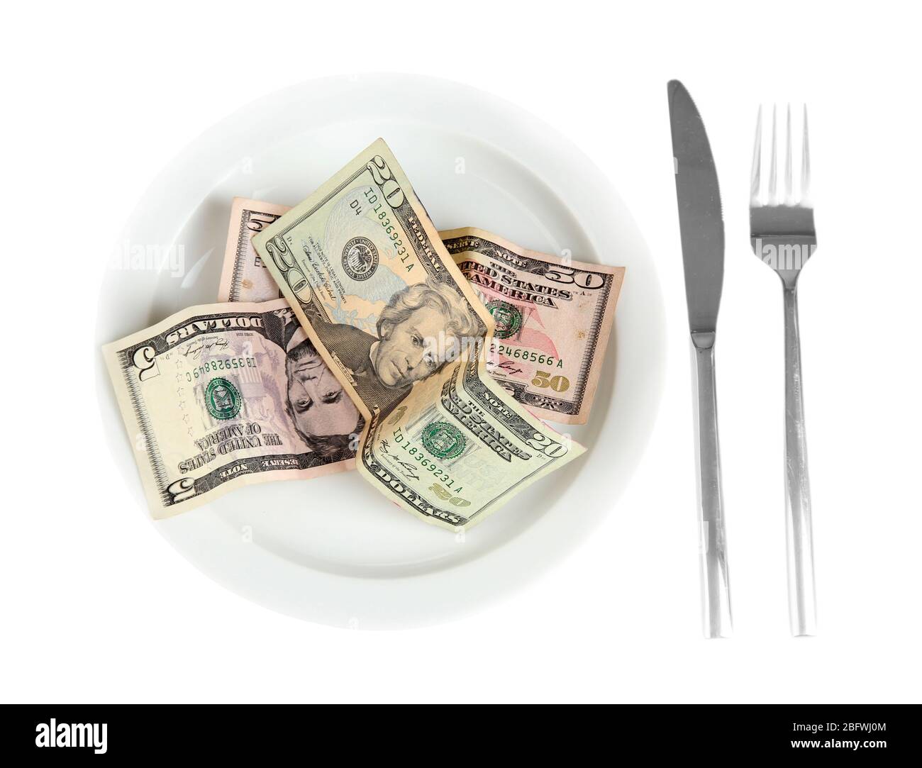 Money on plate isolated on white background close-up Stock Photo - Alamy
