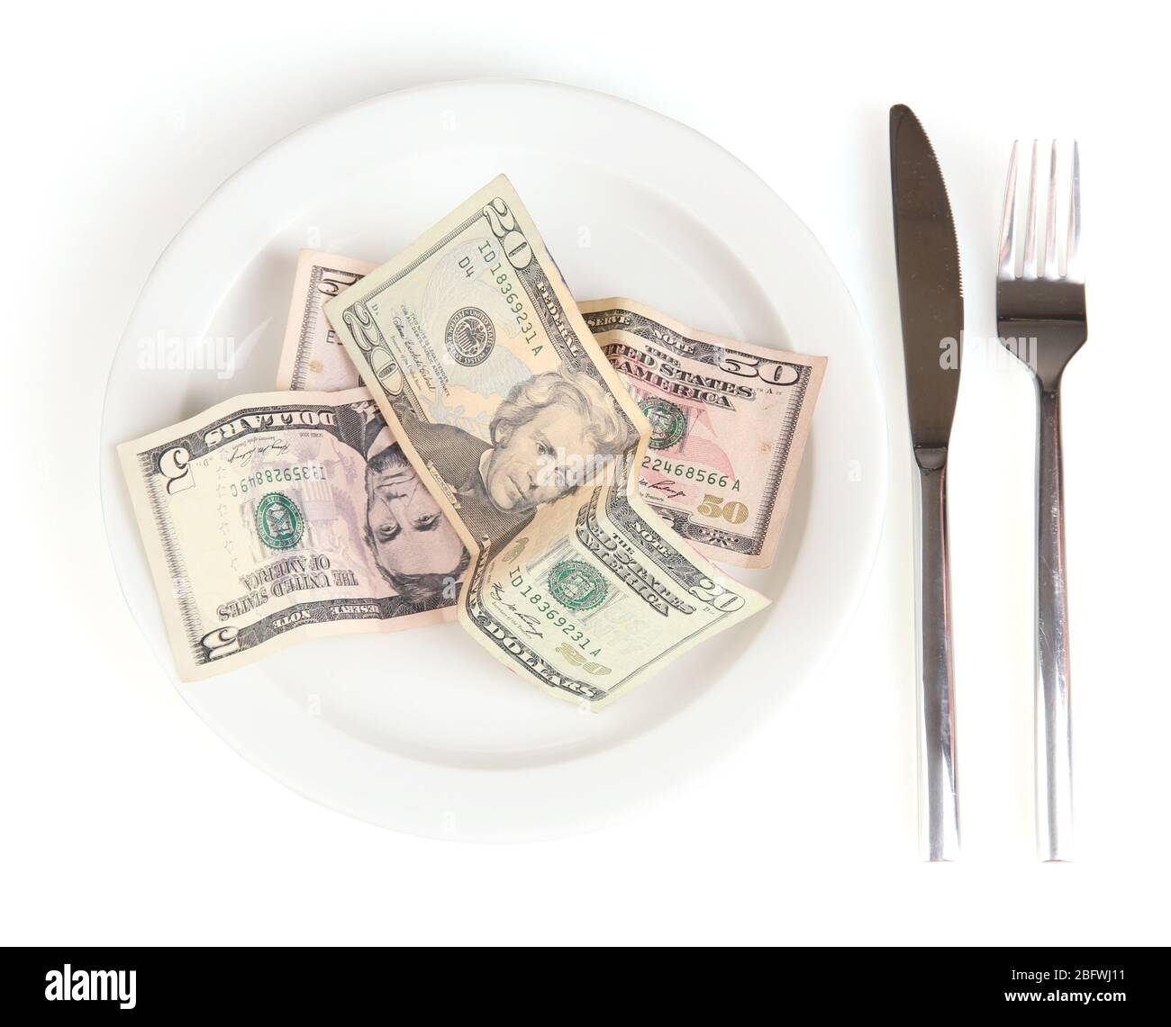 Money on plate isolated on white background close-up Stock Photo - Alamy