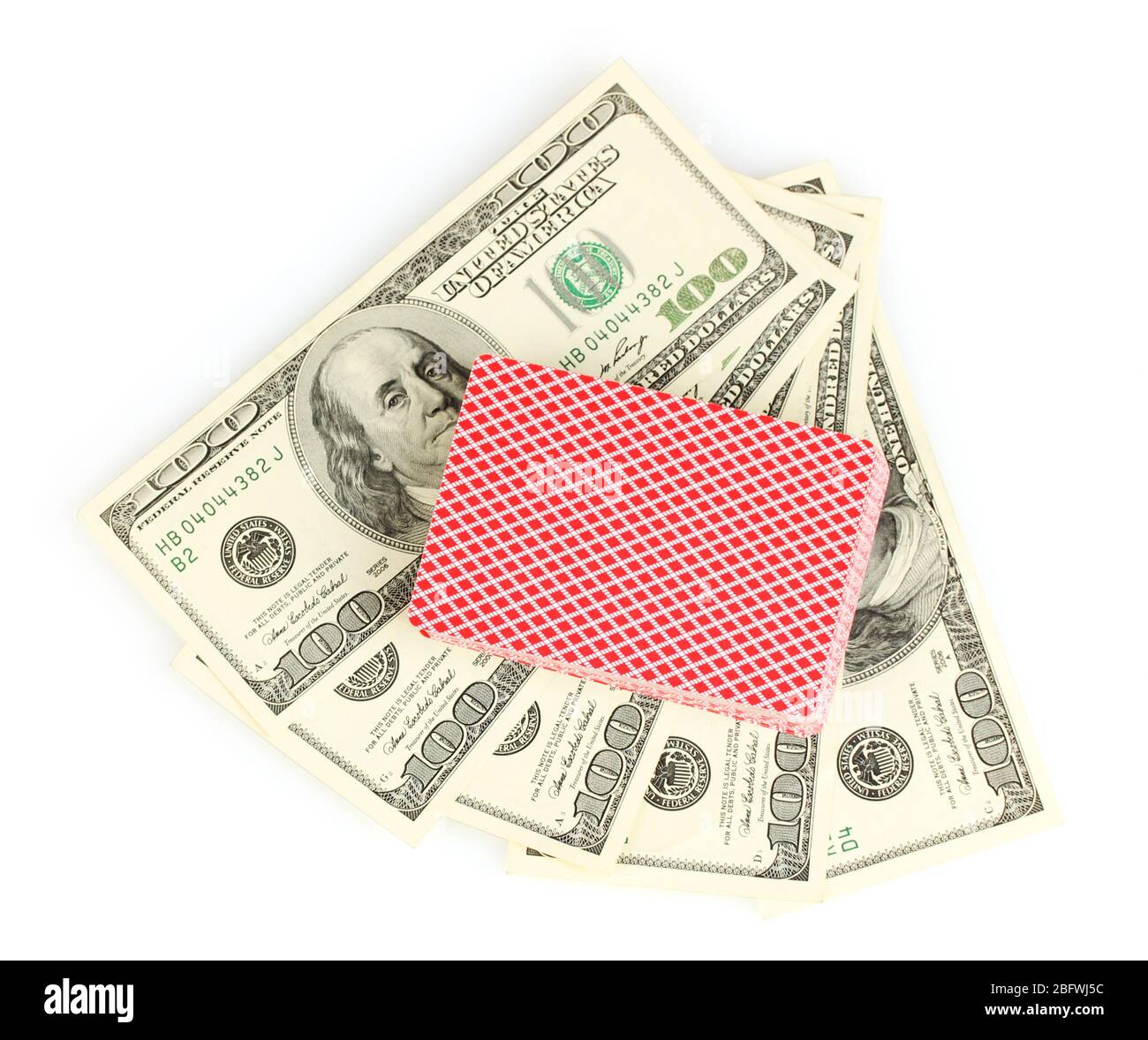 Dollars and a deck of playing cards isolated on white Stock Photo - Alamy