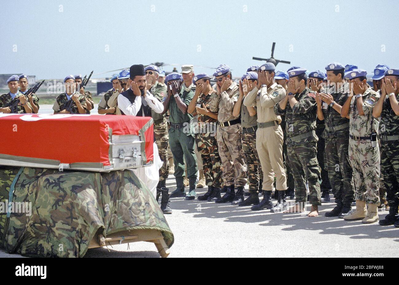 1993 - A Tunisian priest performs the memorial service for a fallen ...
