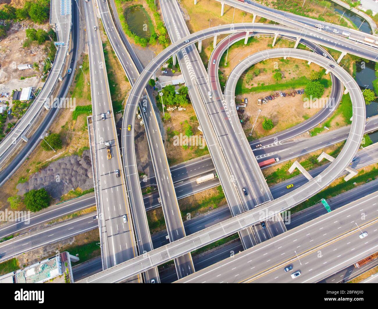 Aerial view elevated city road junction and interchange overpass at day ...