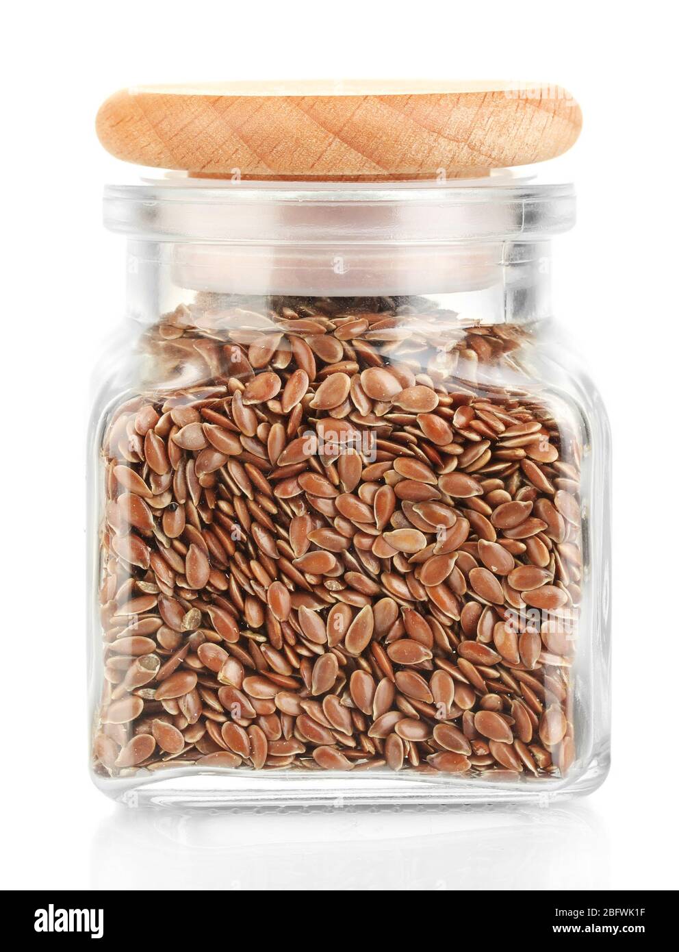 flax seeds in glass jar isolated on white Stock Photo - Alamy