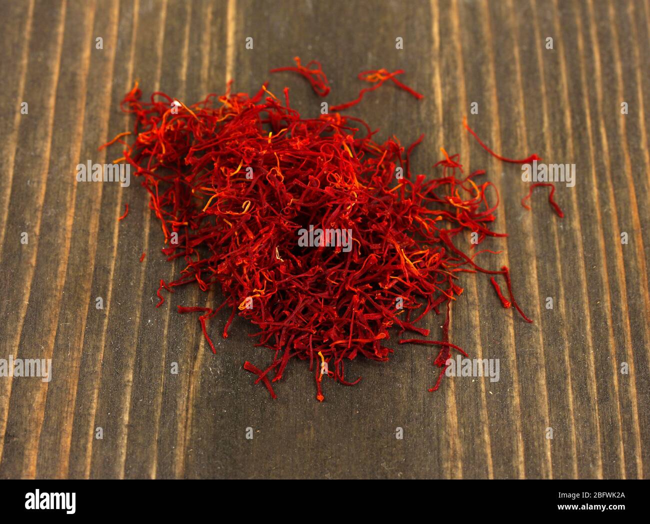 stigmas of saffron on wooden background close-up Stock Photo - Alamy