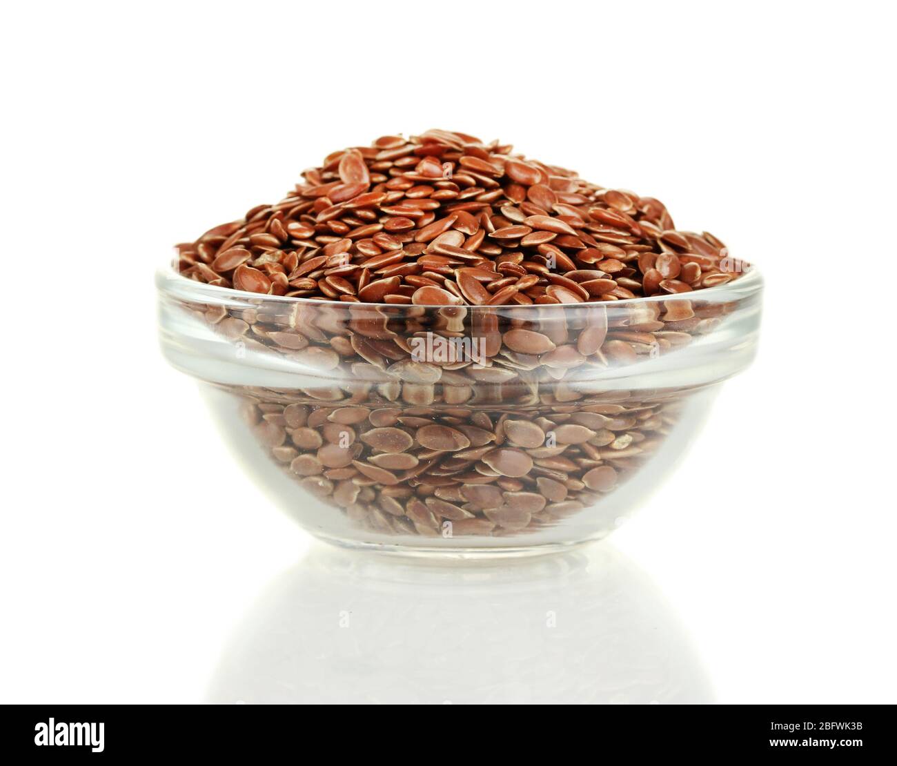 flax seeds in glass bowl isolated on white Stock Photo - Alamy