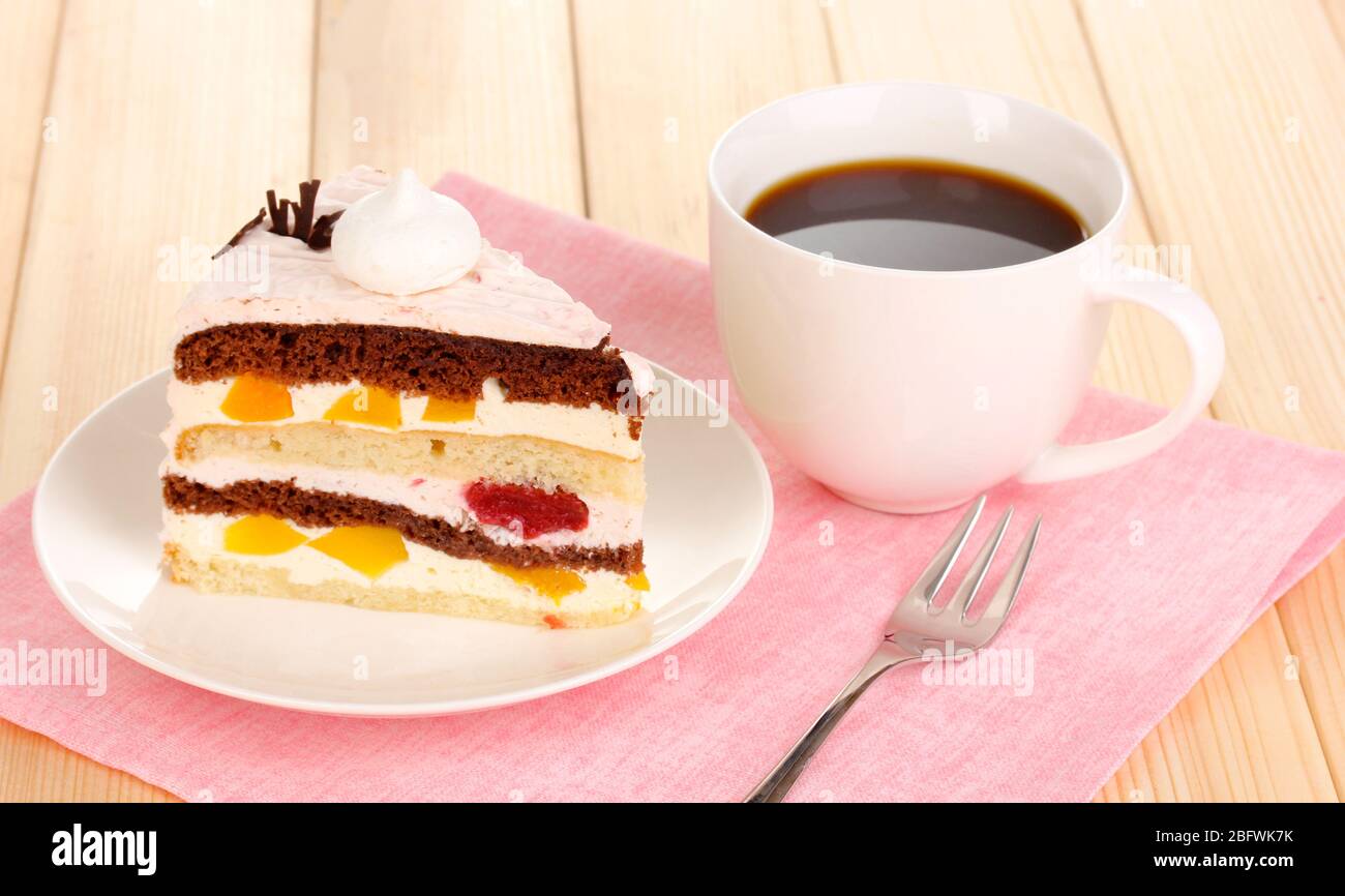Layered fruit cake on wooden table Stock Photo - Alamy