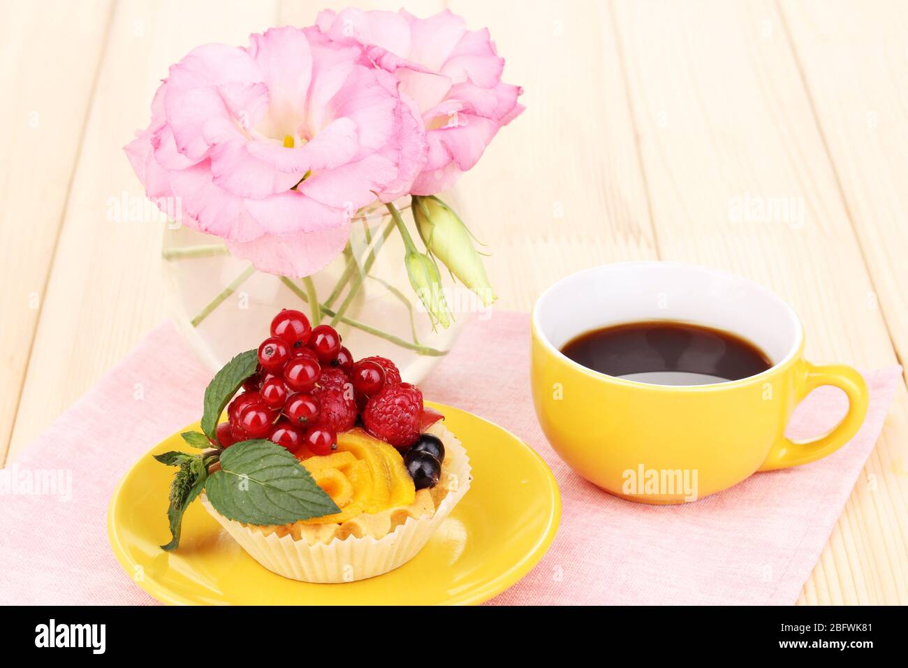 Dulcet cake with fruit and berries on wooden table Stock Photo - Alamy