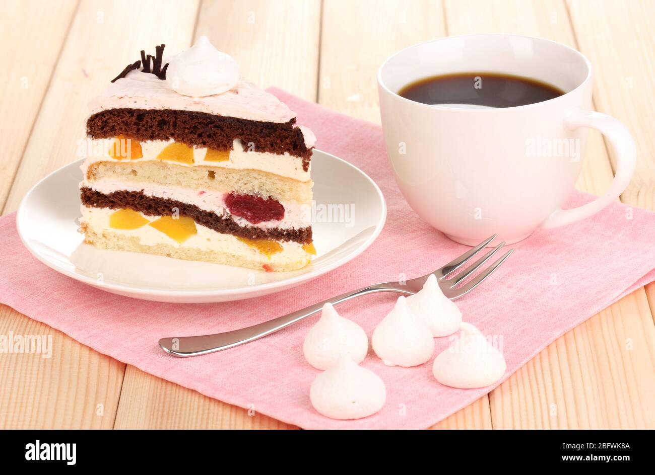 Layered fruit cake on wooden table Stock Photo - Alamy