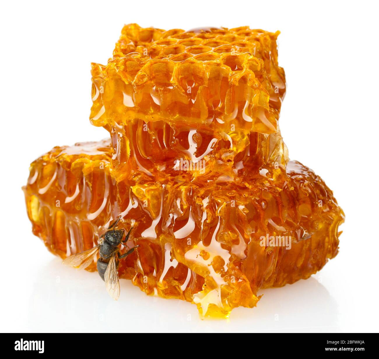 sweet honeycomb with honey and bee, isolated on white Stock Photo - Alamy