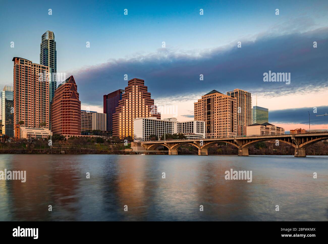 Downtown high-rises reflecting sunset golden hour light viewed across ...