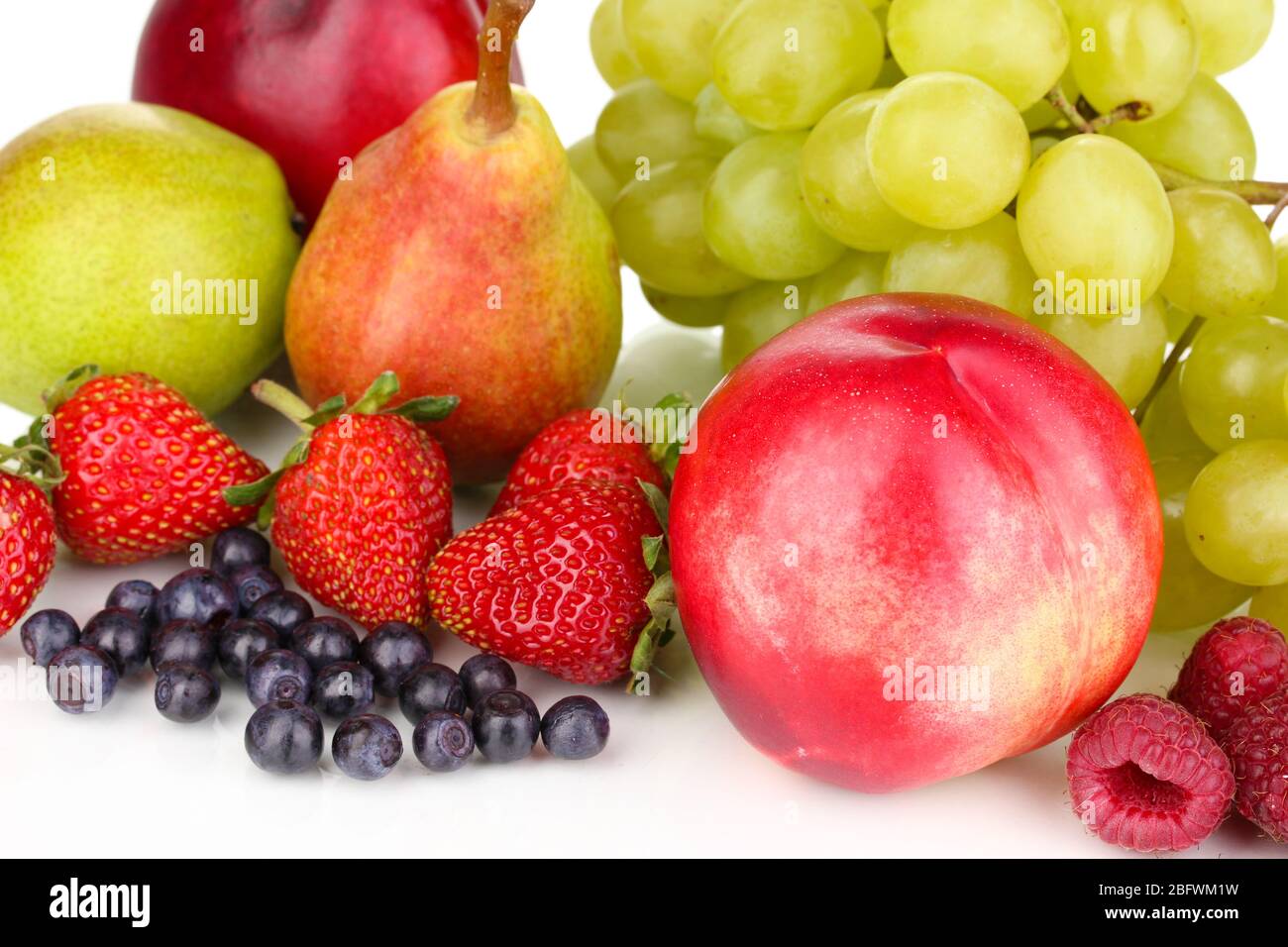 Mix of ripe sweet fruits and berries isolated on white Stock Photo - Alamy