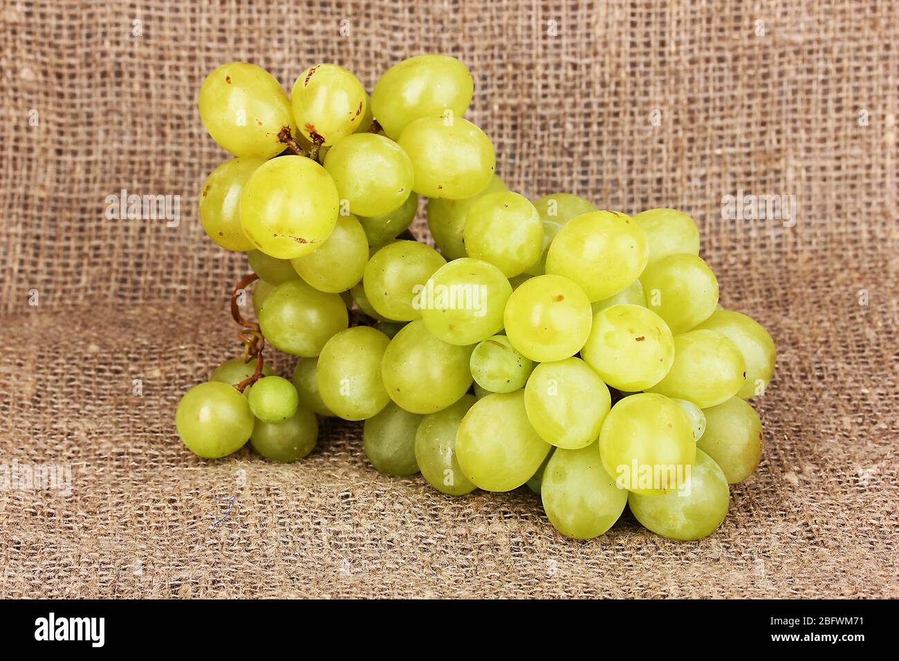 ripe sweet grapes on sackcloth Stock Photo - Alamy