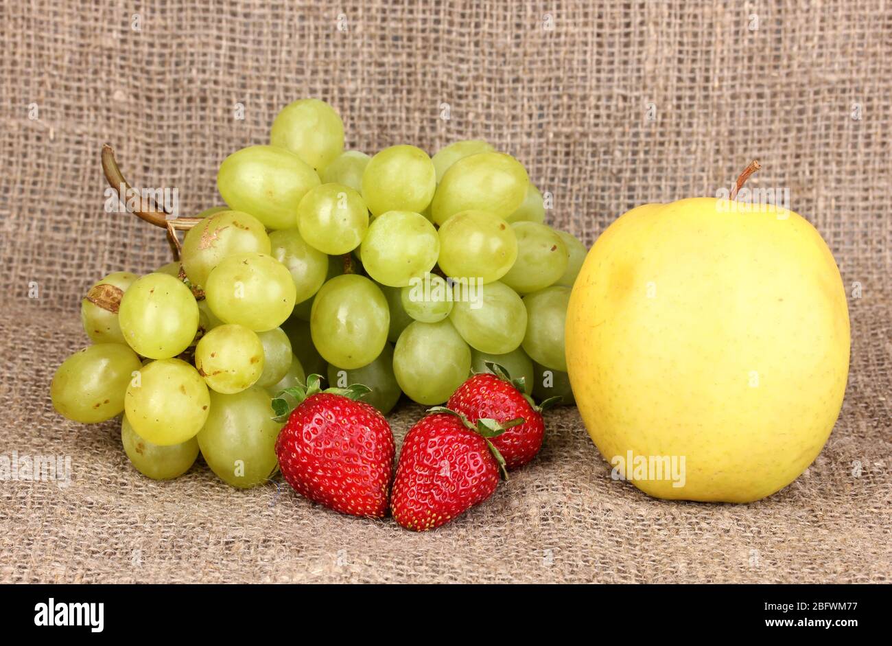 ripe sweet fruits and berries on sackcloth Stock Photo - Alamy
