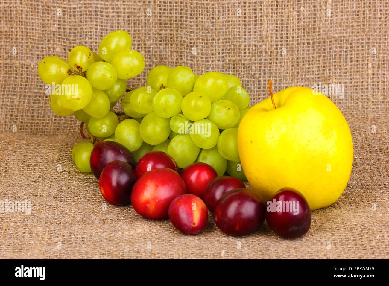 ripe sweet fruits and berries on sackcloth Stock Photo - Alamy