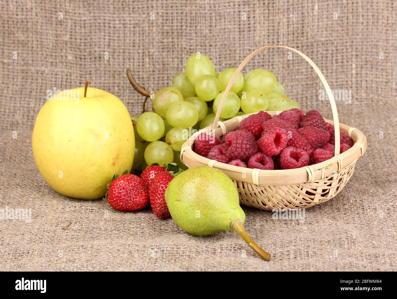 ripe sweet fruits and berries on sackcloth Stock Photo - Alamy