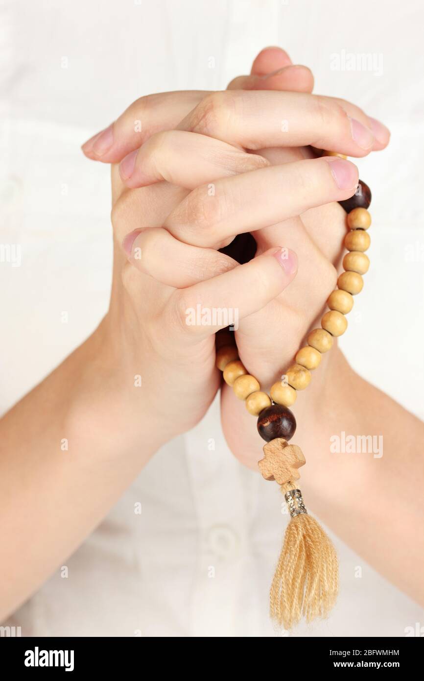 Hands in Prayer with Crucifix close-up Stock Photo - Alamy