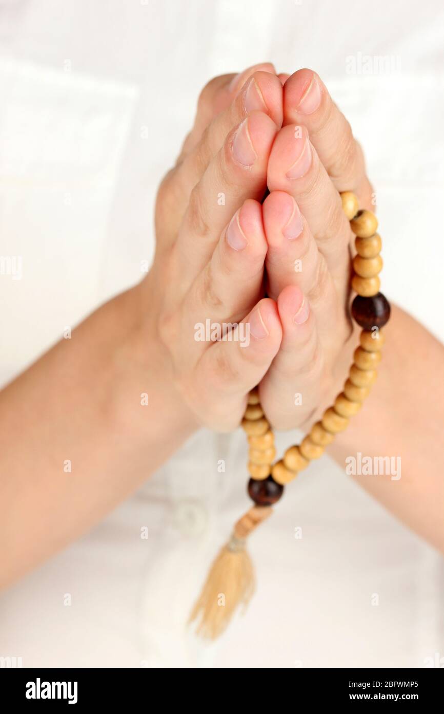 Hands in Prayer with Crucifix close-up Stock Photo - Alamy