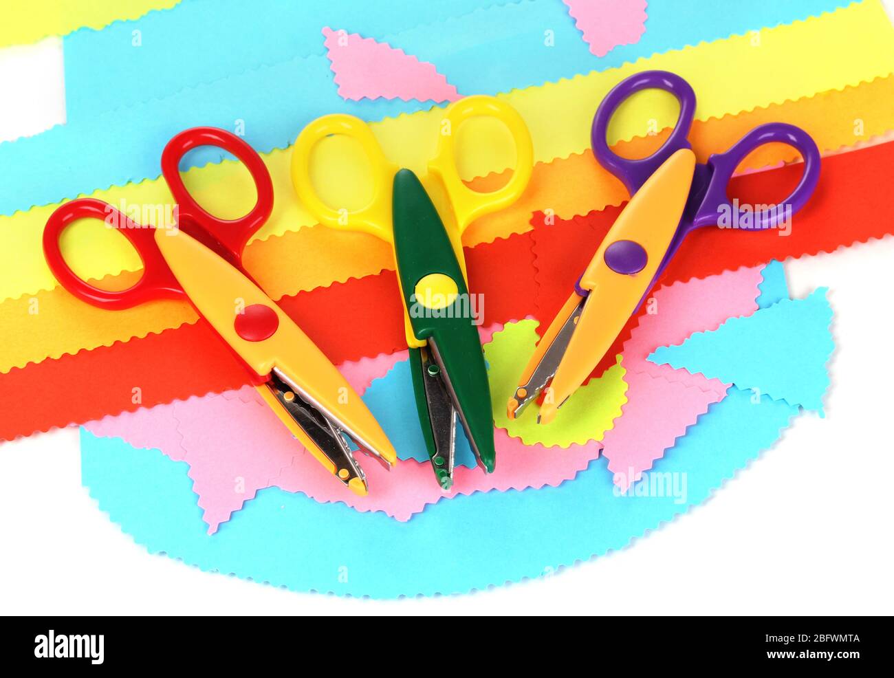 Colorful zigzag scissors with color paper isolated on white Stock Photo ...