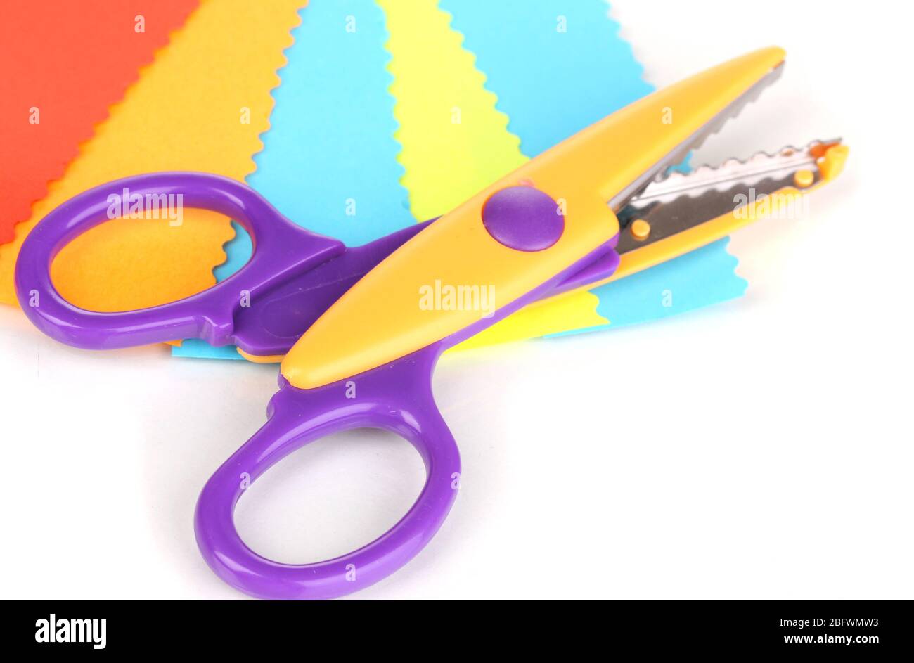 Colorful zigzag scissors with color paper isolated on white Stock Photo ...