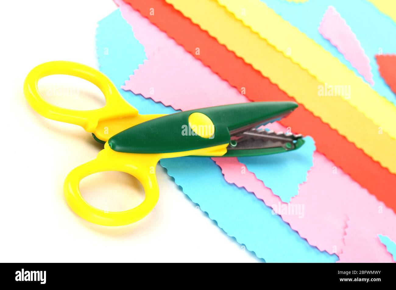 Colorful zigzag scissors with color paper isolated on white Stock Photo ...