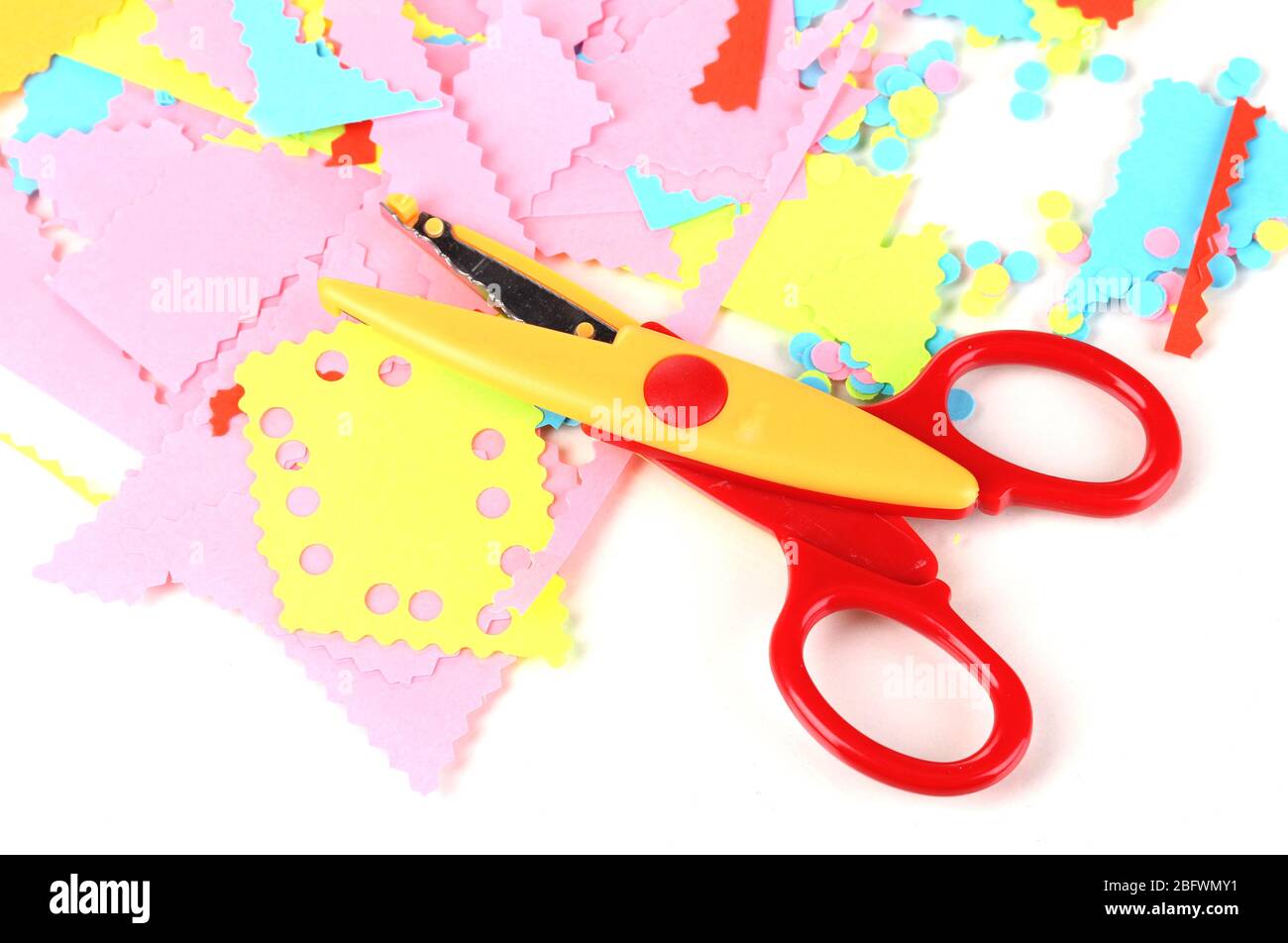 Colorful zigzag scissors with color paper isolated on white Stock Photo ...