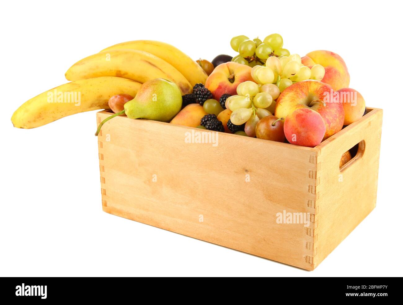 Still life of fruit in a box isolated on white Stock Photo - Alamy