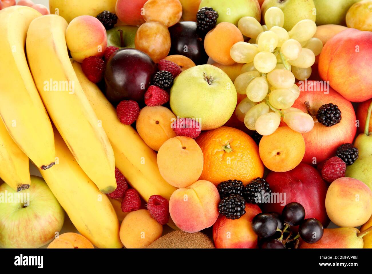 Still life of fruit close-up isolated on white Stock Photo - Alamy