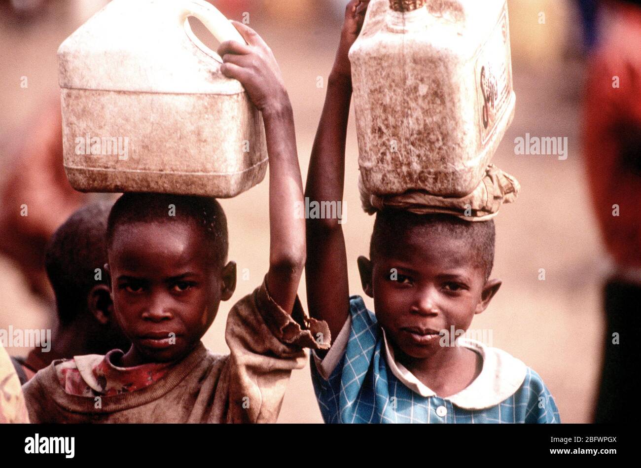 African carrying water jugs hi-res stock photography and images - Alamy